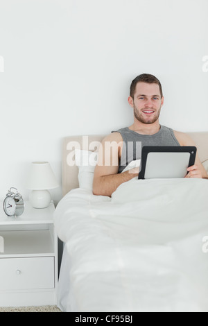 Portrait of handsome caucasian man watching something lovely and cute ...