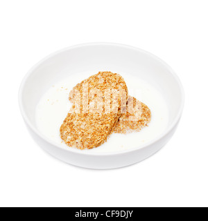 Weetabix breakfast cereal in a bowl with milk sitting on a counter top ...