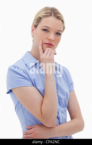 Young woman standing and thinking with copy space Stock Photo - Alamy