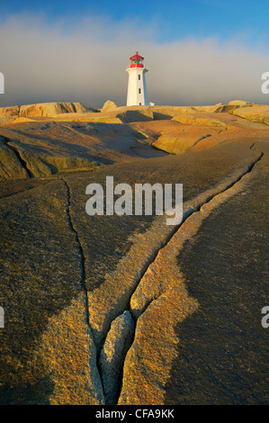 Lighthouse and granite rock formations at Peggy’s Cove, Nova Scotia ...