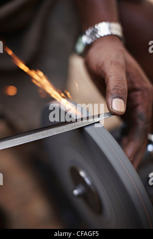 Man sharpening knife, close-up Stock Photo - Alamy
