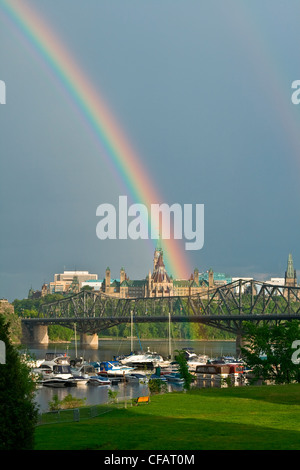Rainbow over Parliament building Stock Photo - Alamy