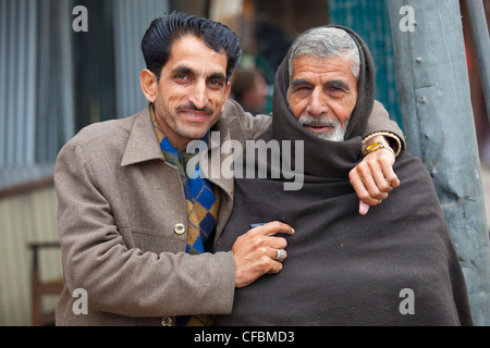 Portrait of two old pakistani men sitting on streets of Gilgit, Hunza ...