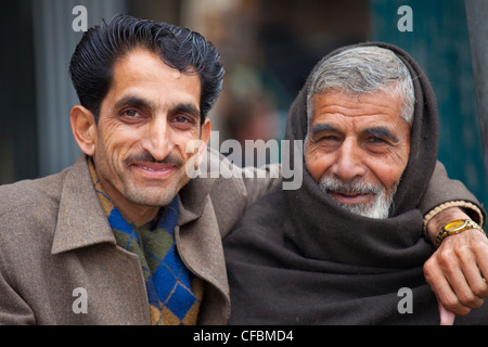 Portrait of two old pakistani men sitting on streets of Gilgit, Hunza ...