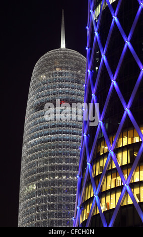 Burj Qatar and the blue illuminated QIPCO Tower in Doha, Qatar Stock ...