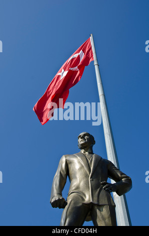 A closeup of a Turkey flag and Mustafa Kemal Ataturk icons in grayscale ...