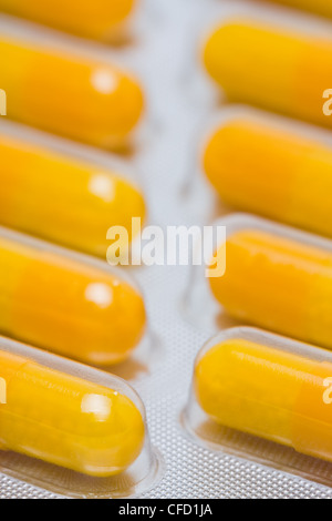 pack of yellow pills, close-up Stock Photo - Alamy