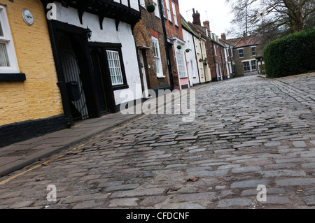 A low angle shot of old historic houses/building under the cloudy sky ...