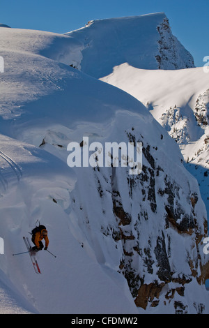 A male skier drops off a cornice in the, Kicking Horse Backcountry ...