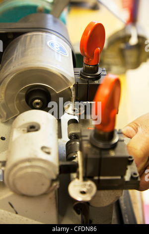 Cylinder yale type key cutting machine being used to copy keys by ...