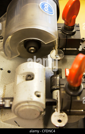 Cylinder yale type key cutting machine being used to copy keys by ...