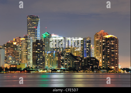 Miami city architecture closeup at dusk with urban skyscrapers over sea ...