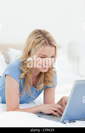 laptop on the bed with white screen copy space Stock Photo - Alamy