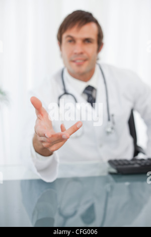 Happy male doctor offering his hand, at the hospital Stock Photo - Alamy