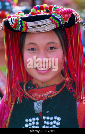 Lisu woman wearing traditional clothing sitting resting with her hand ...