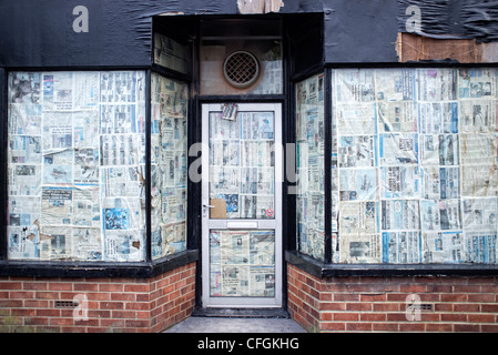 Bankrupt closed down retail shop business with whitewashed windows in a ...