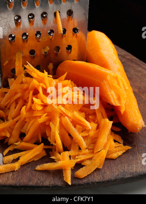 grated carrots and grater Stock Photo - Alamy