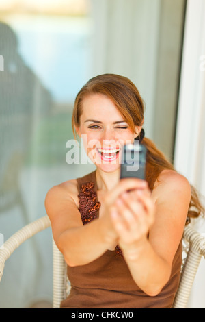 Photo of charming good mood lady wear orange sweater smiling chatting ...