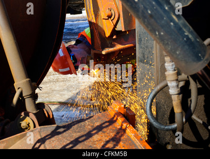 welder welding snow plow Stock Photo - Alamy