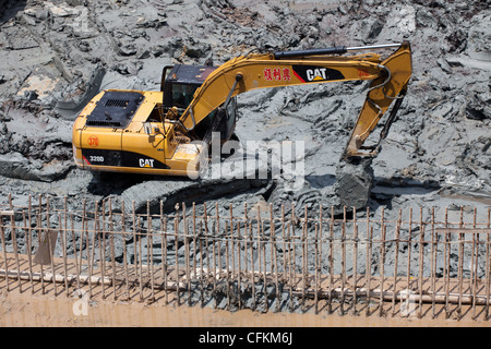 Mechanical Excavator Working in Mud Stock Photo - Alamy