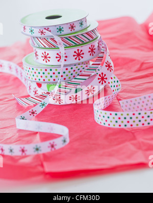 Stack of colorful ribbons on wrapping paper Stock Photo - Alamy