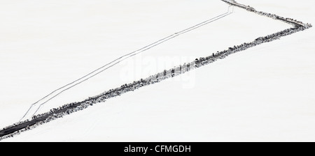 Abstract shot of tracks in snow at sunrise. Winter scene in Swedish ...
