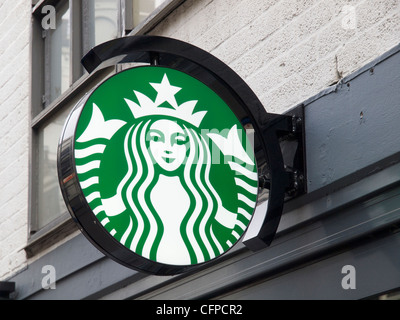 Starbucks Coffee round cafe logo signboard at night, bright logo sign ...