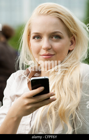 Portrait of young adult using phone Stock Photo - Alamy