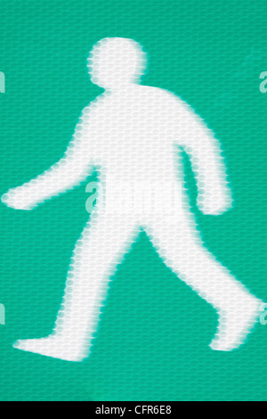 Man walking green go sign at traffic lights Stock Photo - Alamy