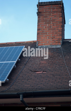 Damaged roof near solar panels Stock Photo - Alamy