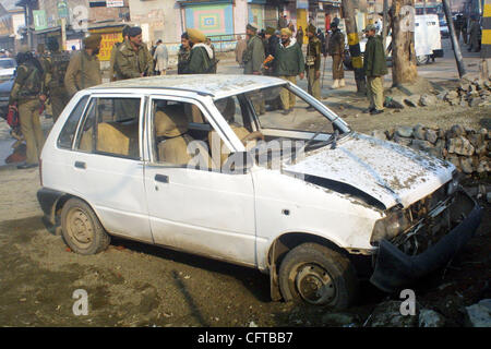 Indian security forces stand near the site of an explosion inside a ...