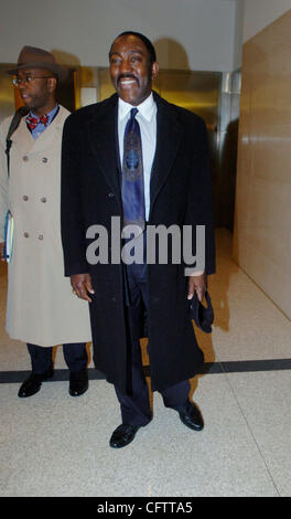 Clarence Norman, Jr., charged with attempted grand larceny, looks on as ...