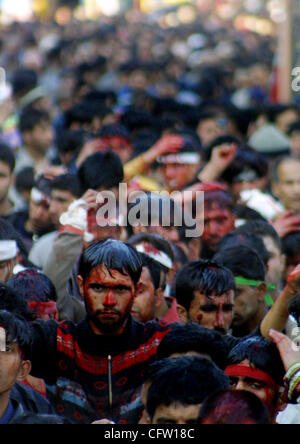 Kashmiri Shiite Muslim perfoming the ritual of "Tatbir" by slicing his ...