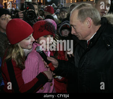 Vladimir Putin with russian kids at the skating rink on the Red Square ...