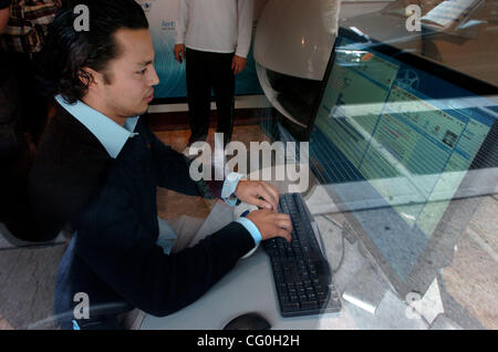 Norman Perez, 24, of Burbank, California at the computer as he ends a ...