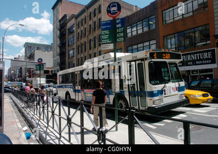 Buses stop at a "Bus Bulb", a new island-like bus stop along lower ...