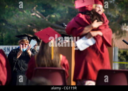 Wearing caps and gowns, two high school senior class co-valedictorians ...