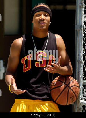 Romeo Miller, formerly known as rap star Lil Romeo, stands on one of ...