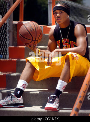 Romeo Miller, formerly known as rap star Lil Romeo, stands on one of ...