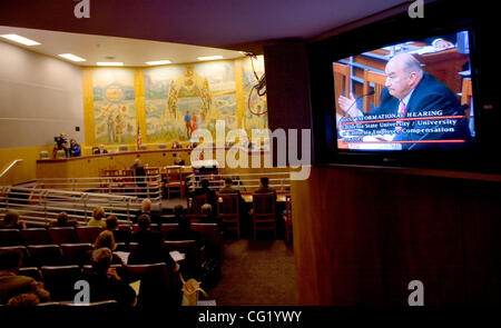 California State University Chancellor Charles Reed, left, shakes hand ...