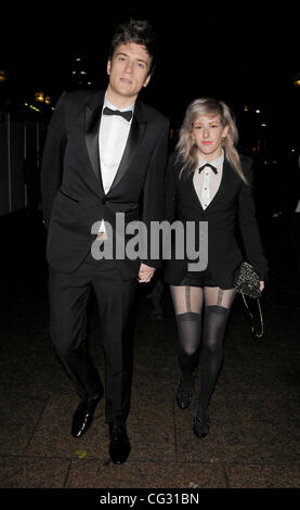 Radio One DJ Greg James and girlfriend singer Ellie Goulding walking ...
