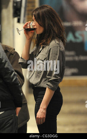 Gemma Arterton shares a rather animated conversation with friends ...