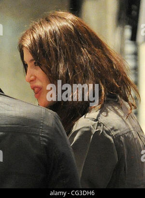 Gemma Arterton shares a rather animated conversation with friends ...