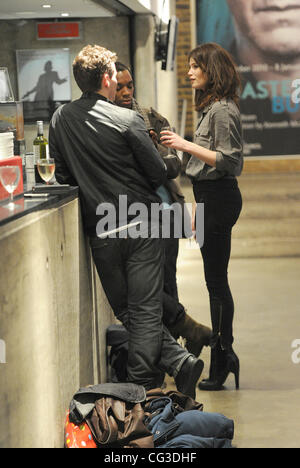 Gemma Arterton shares a rather animated conversation with friends ...