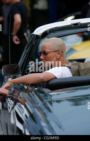 Amber Rose looking at customised cars at Platinum Motorsports in ...