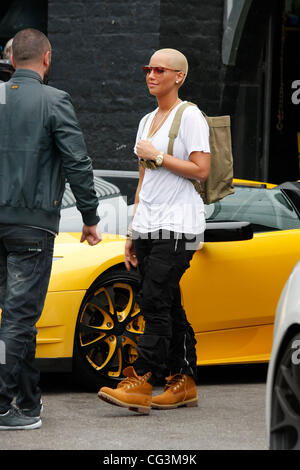Amber Rose looking at customised cars at Platinum Motorsports in ...
