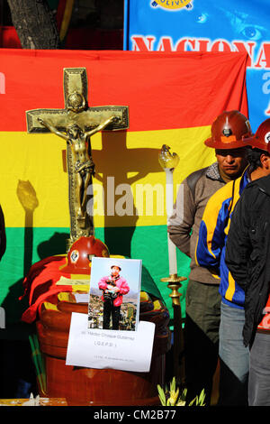 Bolivian Workers' Union members march to protest cuts to fuel subsidies ...