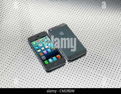 Black Apple iPhone X front side and back side turned towards each other ...