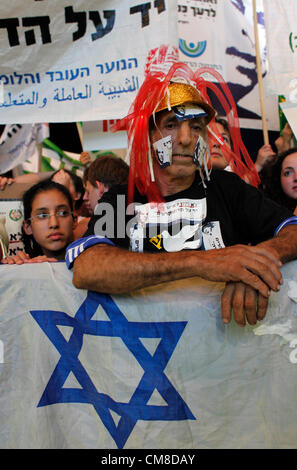 People attend a rally in Tel Aviv, Israel, Saturday, Nov. 8, 2025 ...