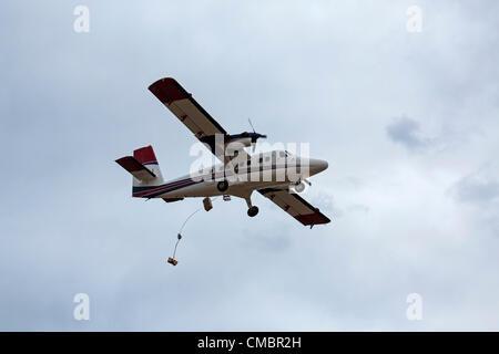 Firemen Smoke Jumpers parachute into wildfire forest fire area to start ...